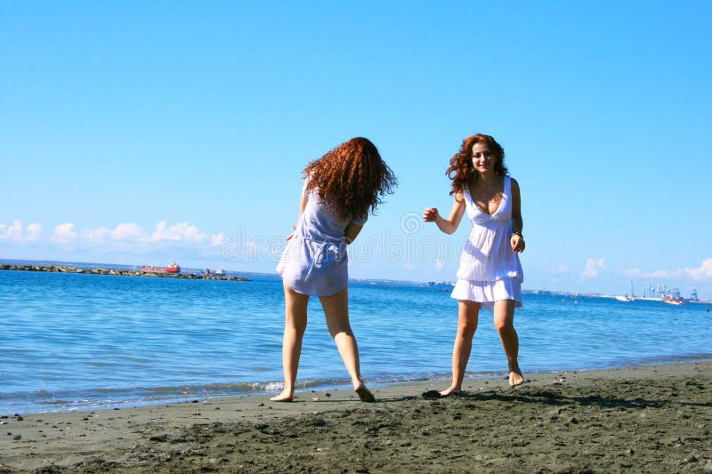 Women on beach stock image. Image of dance, beige, lovely - 30072569