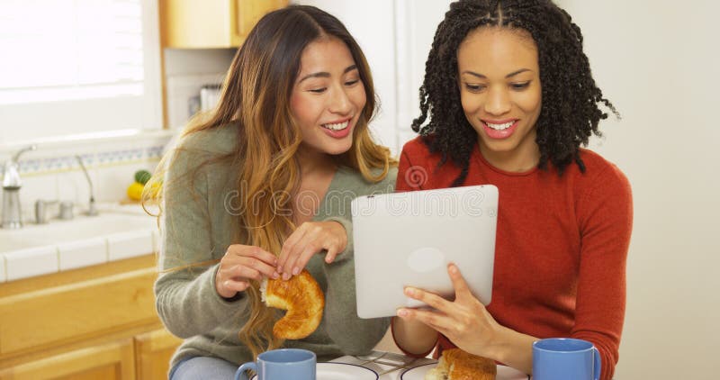 Two Women Best Friends Eating Breakfast and Using Tablet Computer Stock ...