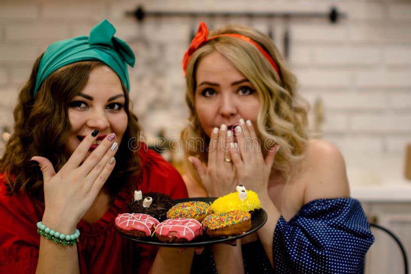 Two Women Bite Tasty Donuts during a Diet. Stock Photo - Image of ...