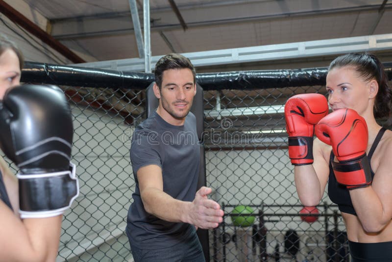 Couple Man and Woman Wearing Gloves Boxing in Ring Stock Image - Image ...