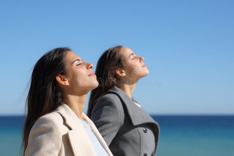 Two Women Breathing Fresh Air in Winter Stock Photo - Image of couple ...
