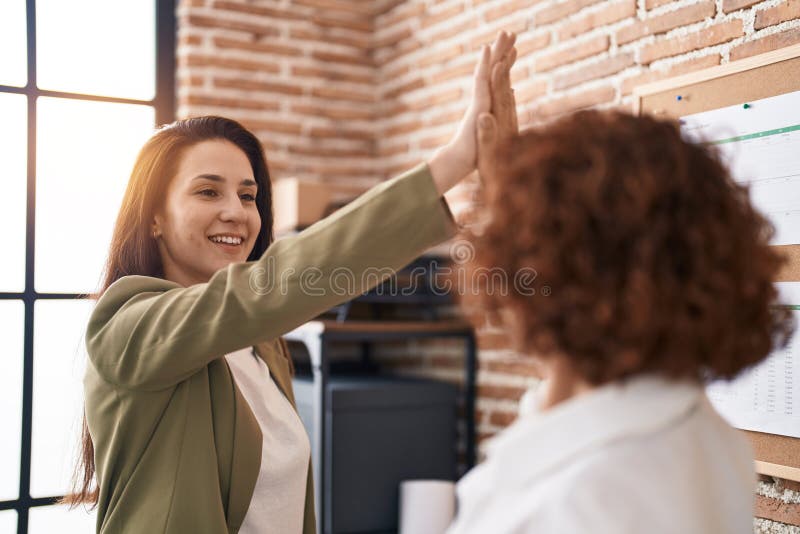Two Women Business Workers High Five with Hands Raised Up at Office ...