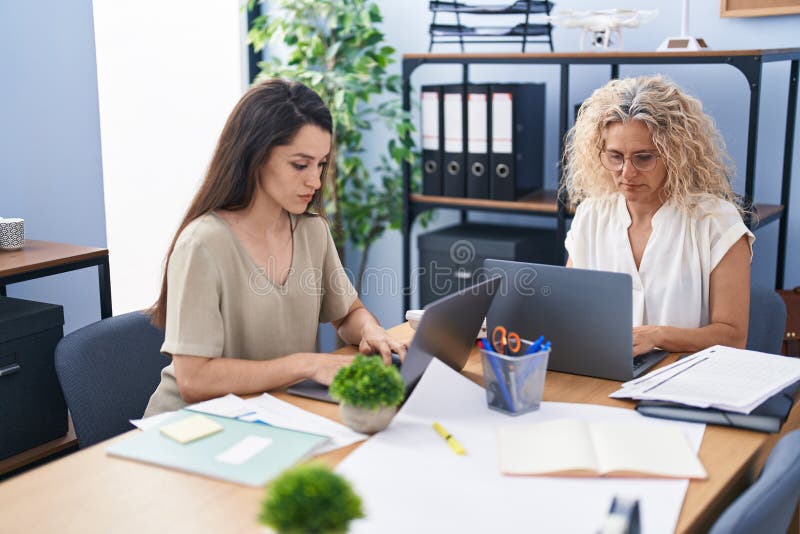 Two Women Business Workers Using Laptop Working at Office Stock Image ...