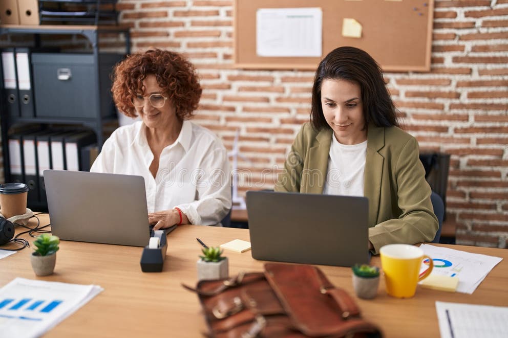 Two Women Business Workers Using Laptop Working at Office Stock Image ...