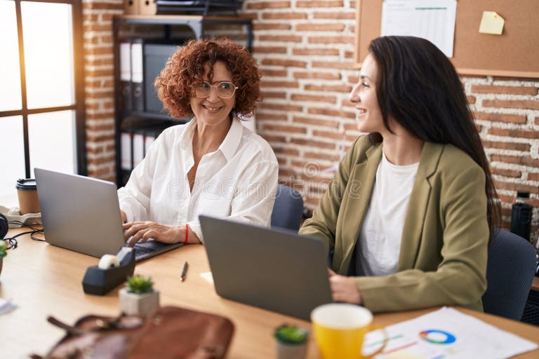 Two Women Business Workers Using Laptop Working at Office Stock Image ...