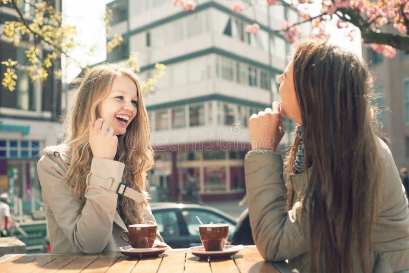 Two women in a cafe stock image. Image of attractive - 31185109