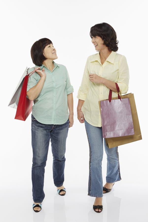Two Women Carrying Shopping Bags Stock Photo - Image of people, hobby ...