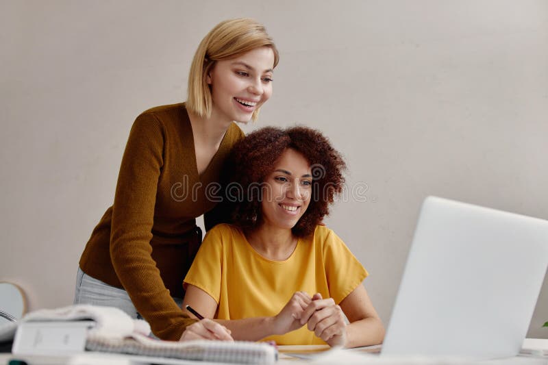 Two Women Colleagues in Office Working Together. Stock Image - Image of ...