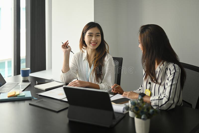 Two Women Colleagues Working Together in Office. Stock Photo - Image of ...