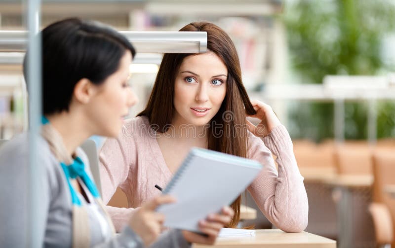 Two Women Communicate Sitting at the Desk Stock Photo - Image of desk ...