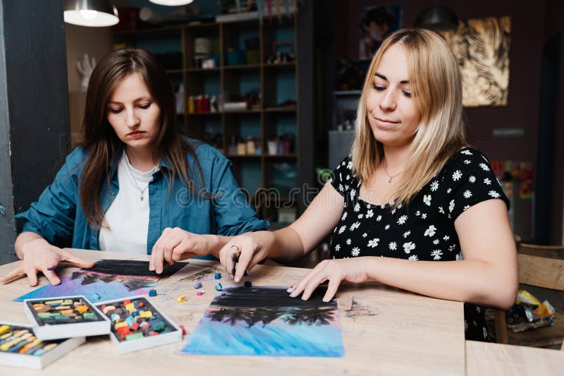Two Women Creating Pastel Artwork Together in a Cozy Studio Setting ...