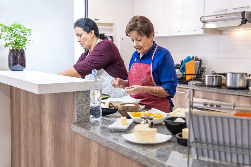 Two Women of Different Generations Cooking Stock Photo - Image of ...