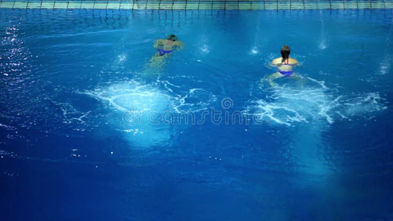Two Women Dives in Water of Pool during Double Stock Video - Video of ...
