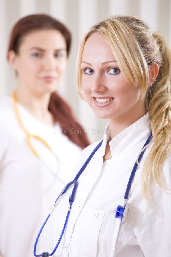 Two women doctors stock photo. Image of together, patient - 20459816