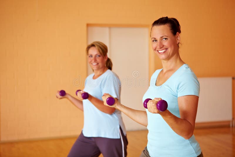 Two Women Doing Dumbbell Exercises Stock Photo - Image of overweight ...