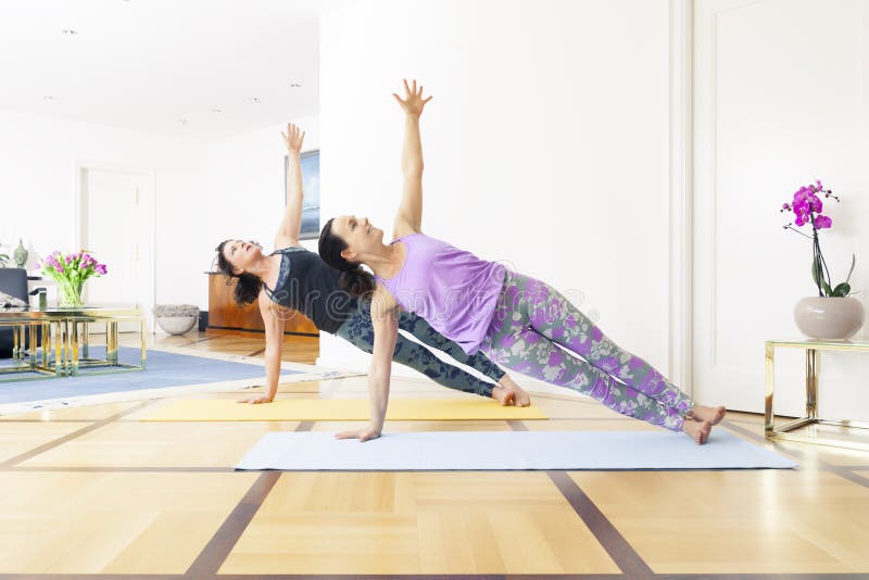 Two Women Doing Yoga at Home Stock Image - Image of friends, sport ...