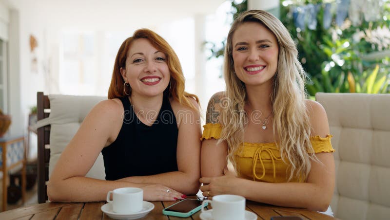 Two Women Drinking Coffee Sitting on Table at Home Terrace Stock Photo ...