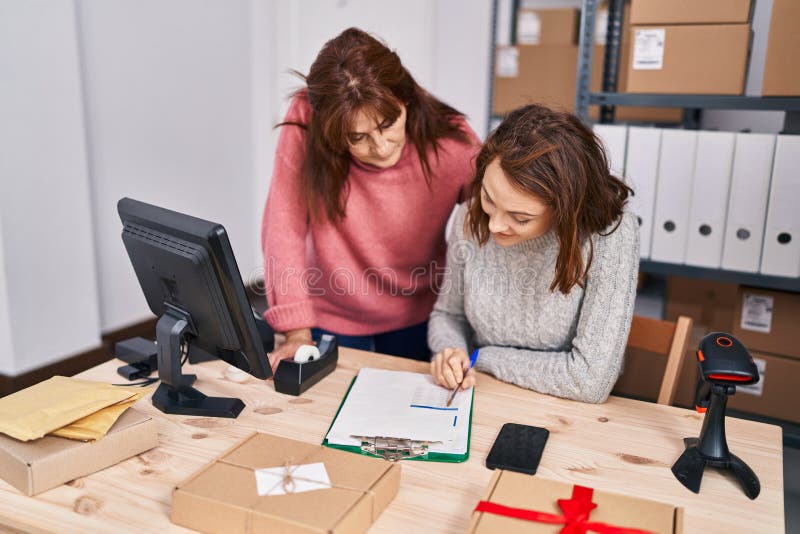 Two Women Ecommerce Business Workers Writing on Document at Office ...