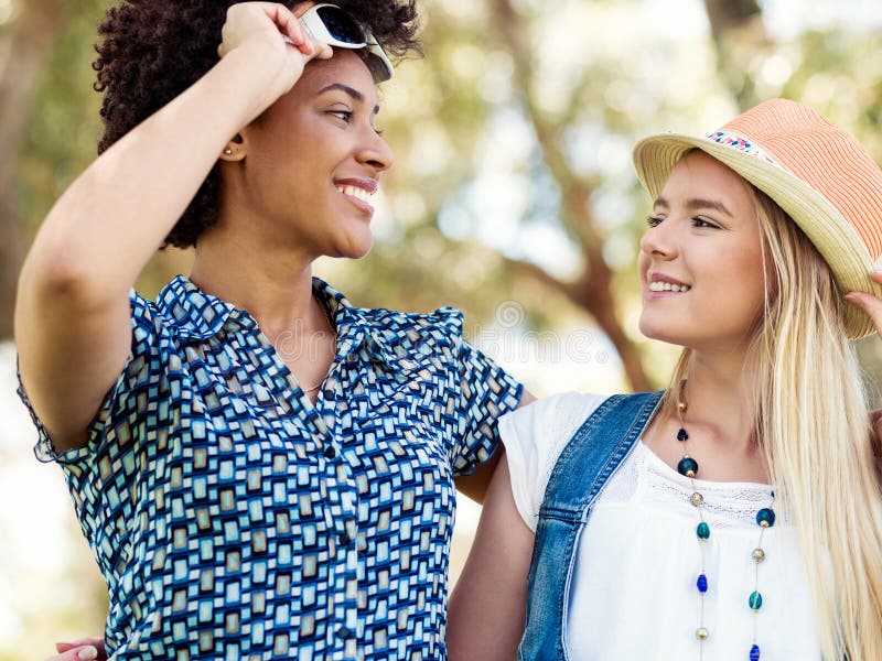 Two women friends in park stock photo. Image of happiness - 78507394