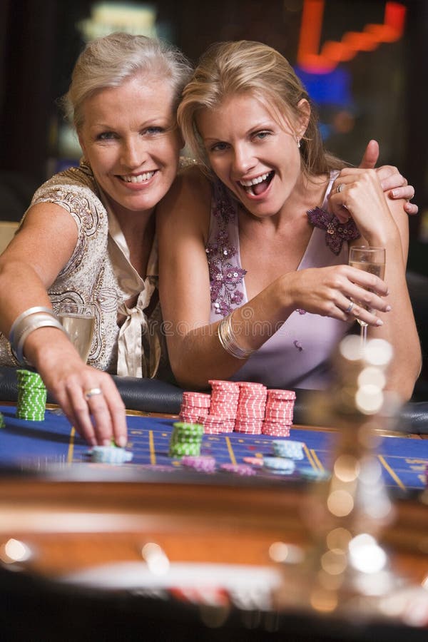 Two Women Gambling at Roulette Table Stock Image - Image of people ...