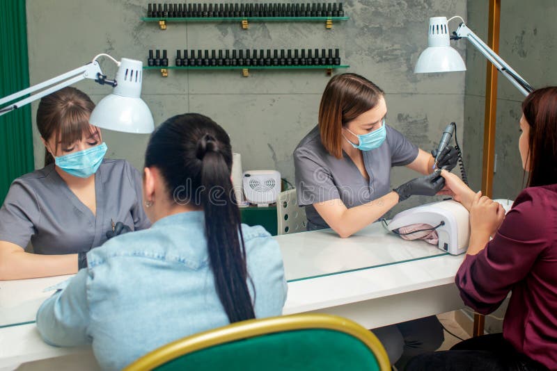 Two Women Getting Manicure in Salon Stock Photo - Image of long, clean ...