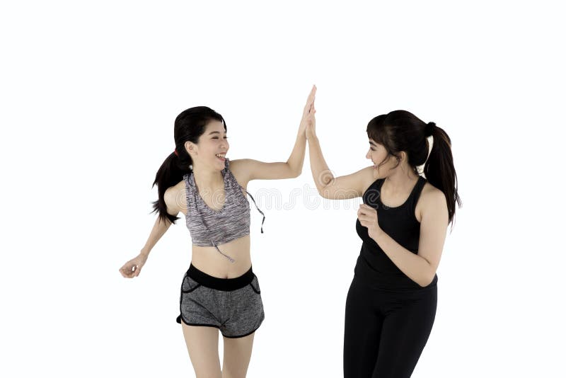 Two Women Giving High Five in Studio Stock Image - Image of friendly ...