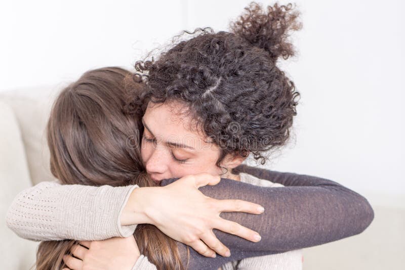 Two women giving a hug stock photo. Image of delighted - 54258712