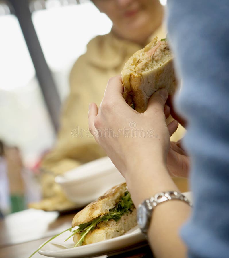 Two women having lunch stock image. Image of cafe, drink - 2793793