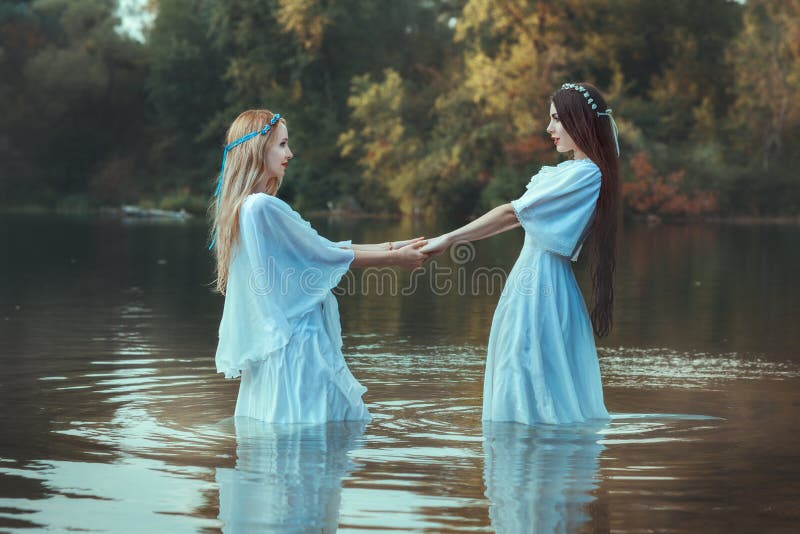 Two women holding hands. stock image. Image of girl, natural - 74176563