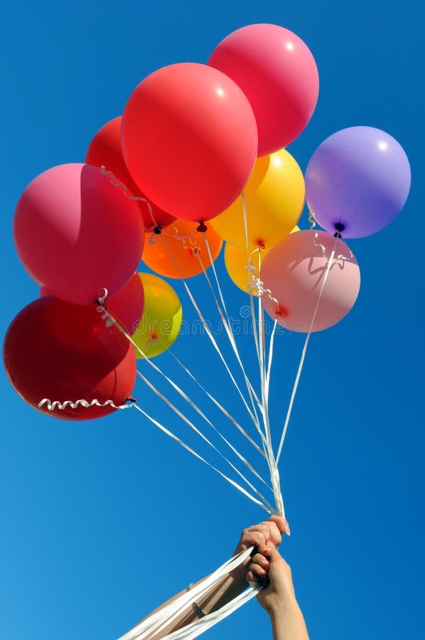 Two Women Holding Multicolored Balloons Stock Photo - Image of behavior ...