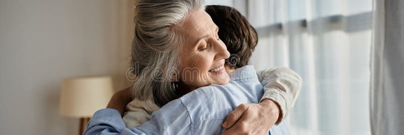 Two women hug in front of stock photo. Image of embrace - 322853928