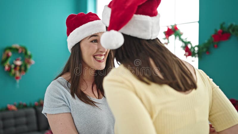 Two Women Hugging Each Other Celebrating Christmas at Home Stock ...