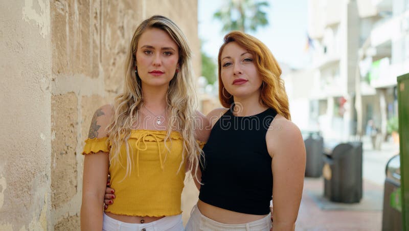 Two Women Hugging Each Other with Relaxed Expression at Street Stock ...