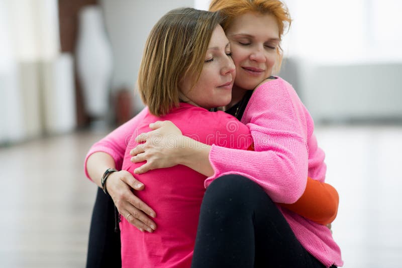 Two women are hugging stock photo. Image of couple, meditation - 178524342