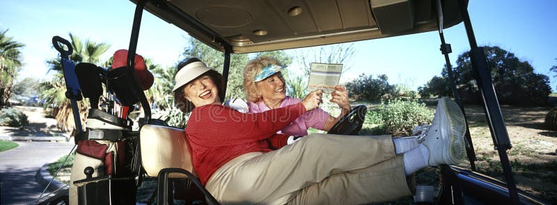 Two Women Laughing in Golf Cart Stock Image - Image of active, adult ...
