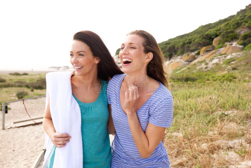 Two Women Laughing in a Park Stock Image - Image of beautiful ...