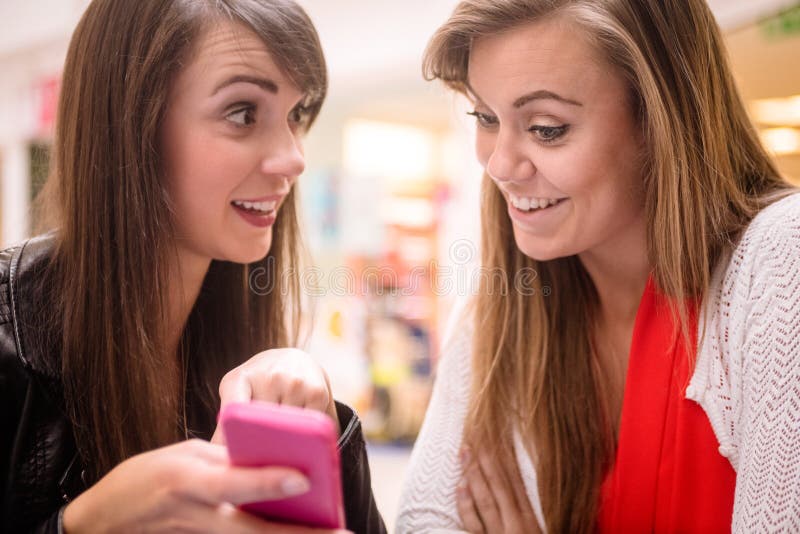 Two Women Looking at Mobile Phone Stock Image - Image of enjoyment ...