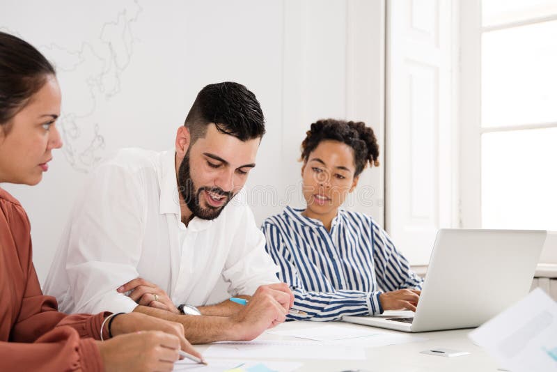 Two Women and a Man in a Meeting Stock Photo - Image of computer ... Two Women and a Man in a Meeting Stock Photo - Image of computer ...
