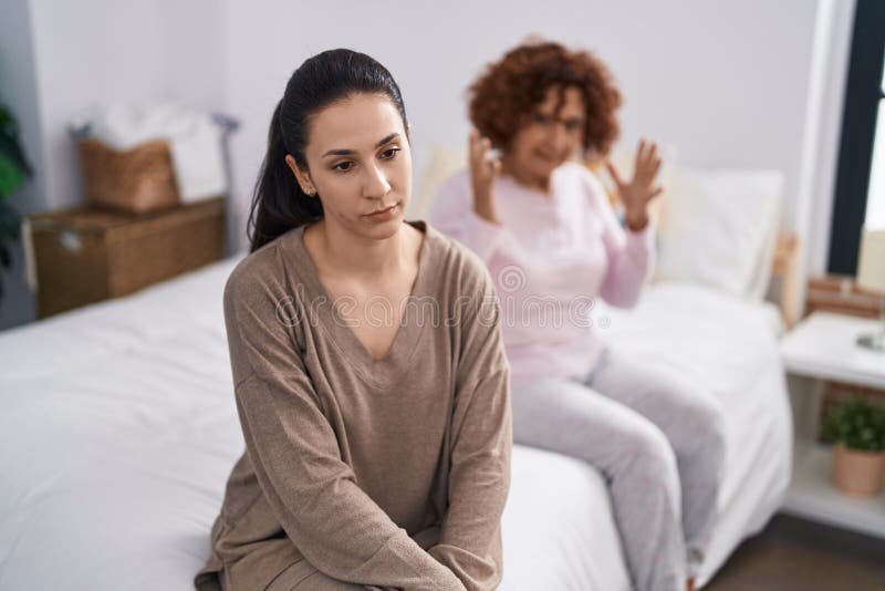 Two Women Mother and Daughter Arguing Sitting on Bed Stock Photo ...