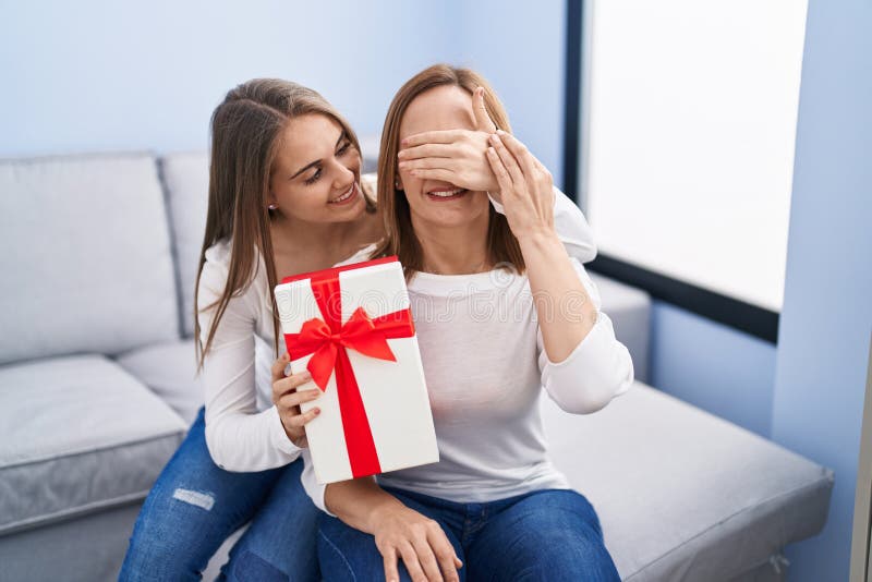 Two Women Mother And Daughter Surprise With Birthday T At Home Stock