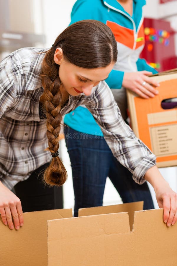 Two Women with Moving Box in Her House Stock Image - Image of company ...