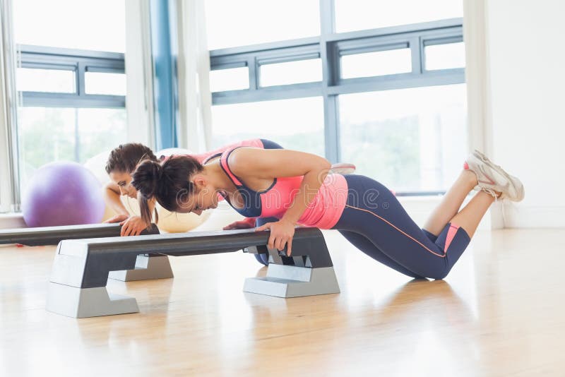 Two Women Performing Step Aerobics Exercise in Gym Stock Photo - Image ...