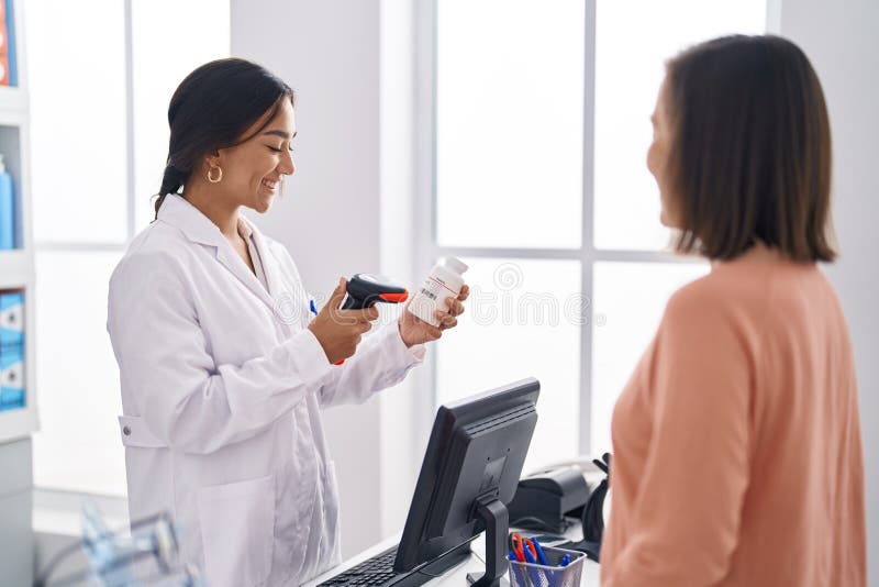 Two Women Pharmacist and Customer Prescribe Pills at Pharmacy Stock ...