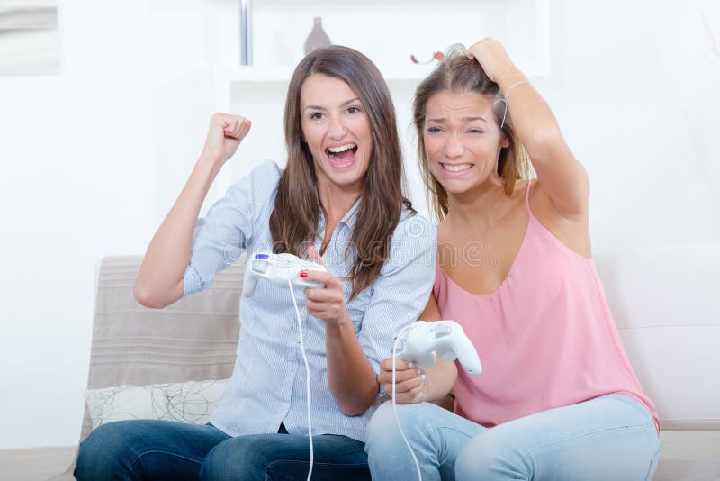 Two Women Playing Video Game Stock Photo - Image of competition, video ...