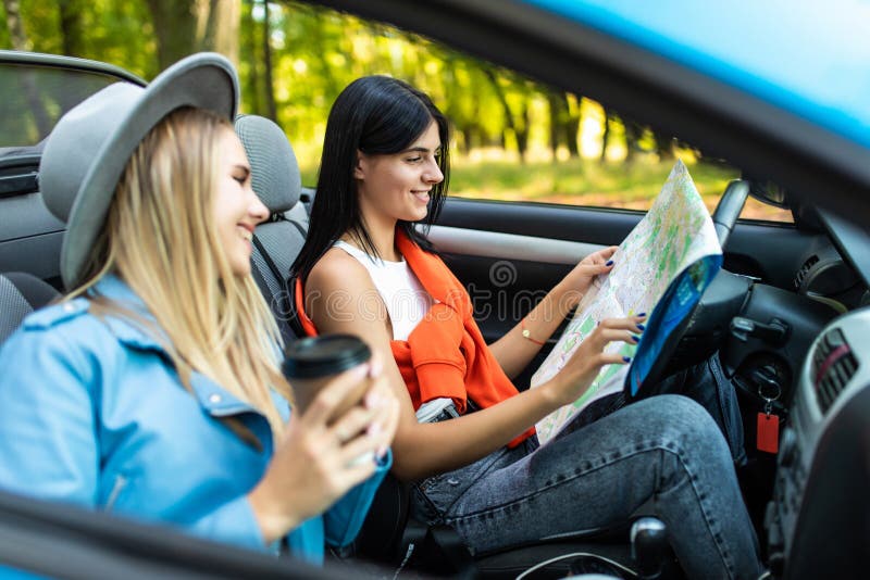 Two Women Reading a Map in a Convertible Car Stock Image - Image of ...