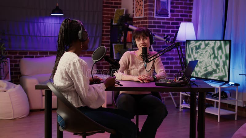 Two Women Recording Interview Using Professional Microphone in Front of ...