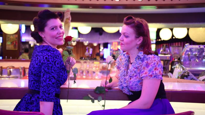 Two Women with Roses Sit in Bar of Retro Stock Footage - Video of ...