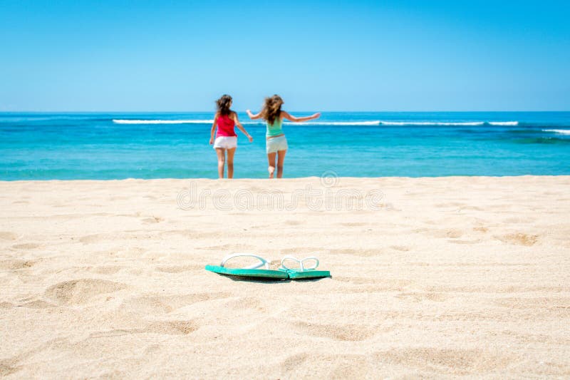 Two Women Running To the Ocean Stock Photo - Image of beautiful, blue ...