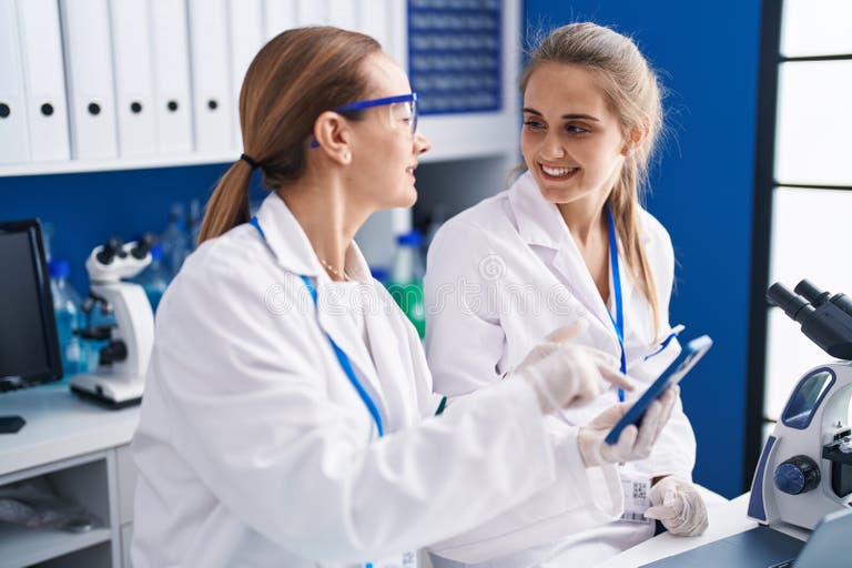 Two Women Scientists Using Smartphone Working at Laboratory Stock Image ...