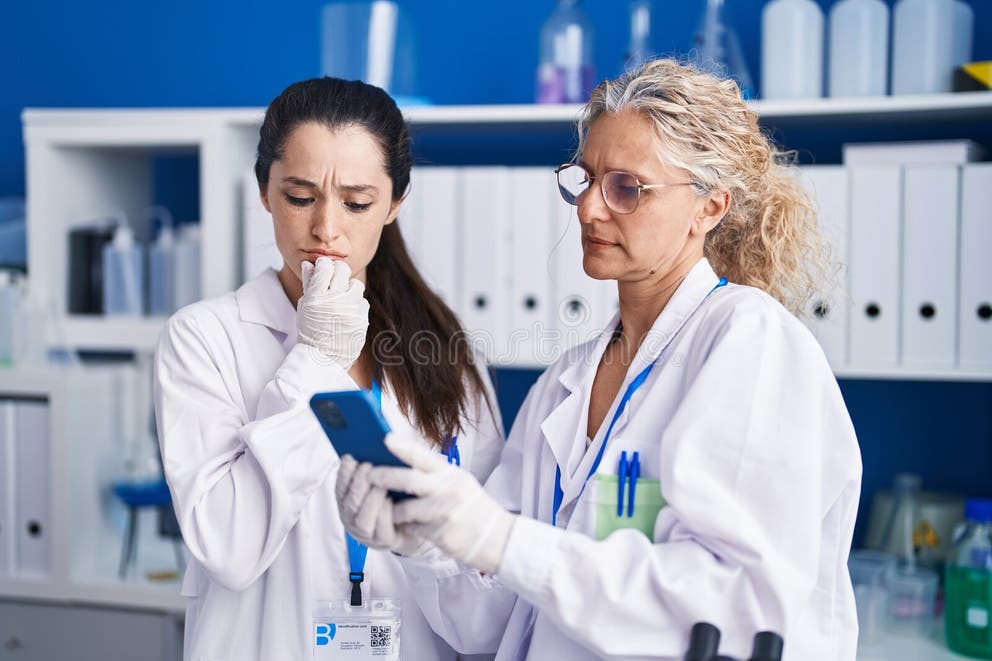 Two Women Scientists Using Smartphone Working at Laboratory Stock Image ...